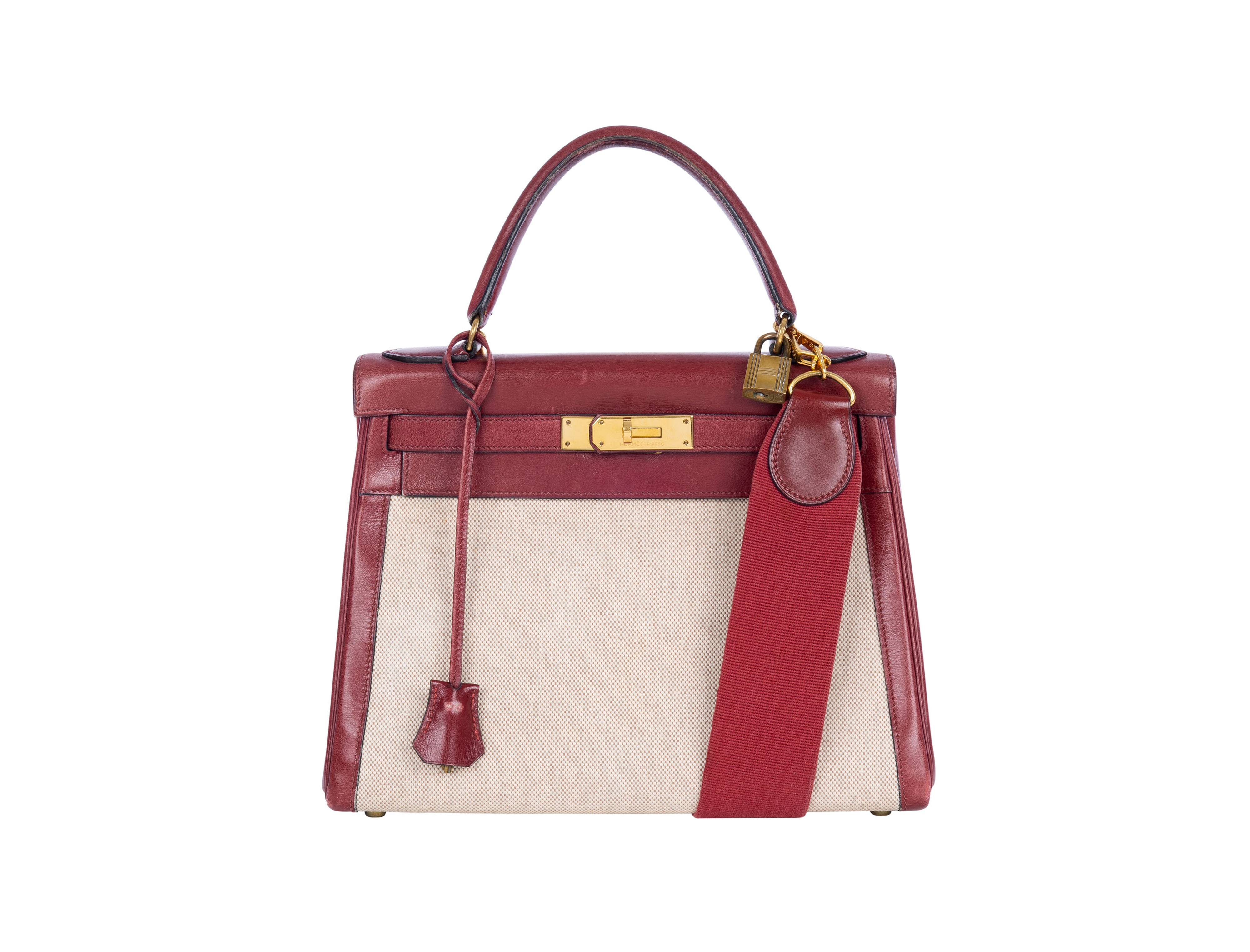 Hermès, sac Kelly 28 en cuir box bordeaux et toile… | Piguet