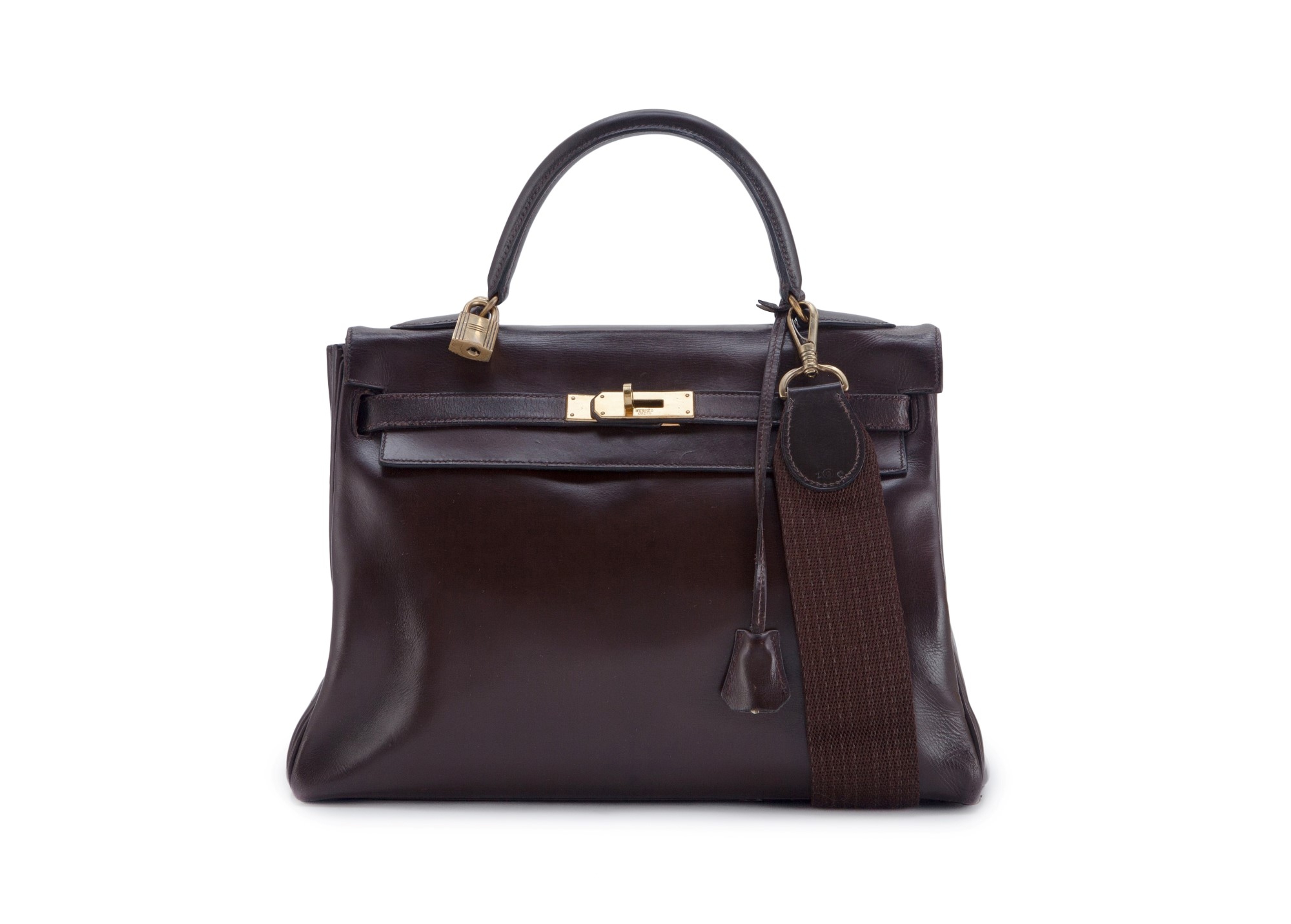 Hermès, sac Kelly 32 en cuir Box chocolat,… | Piguet