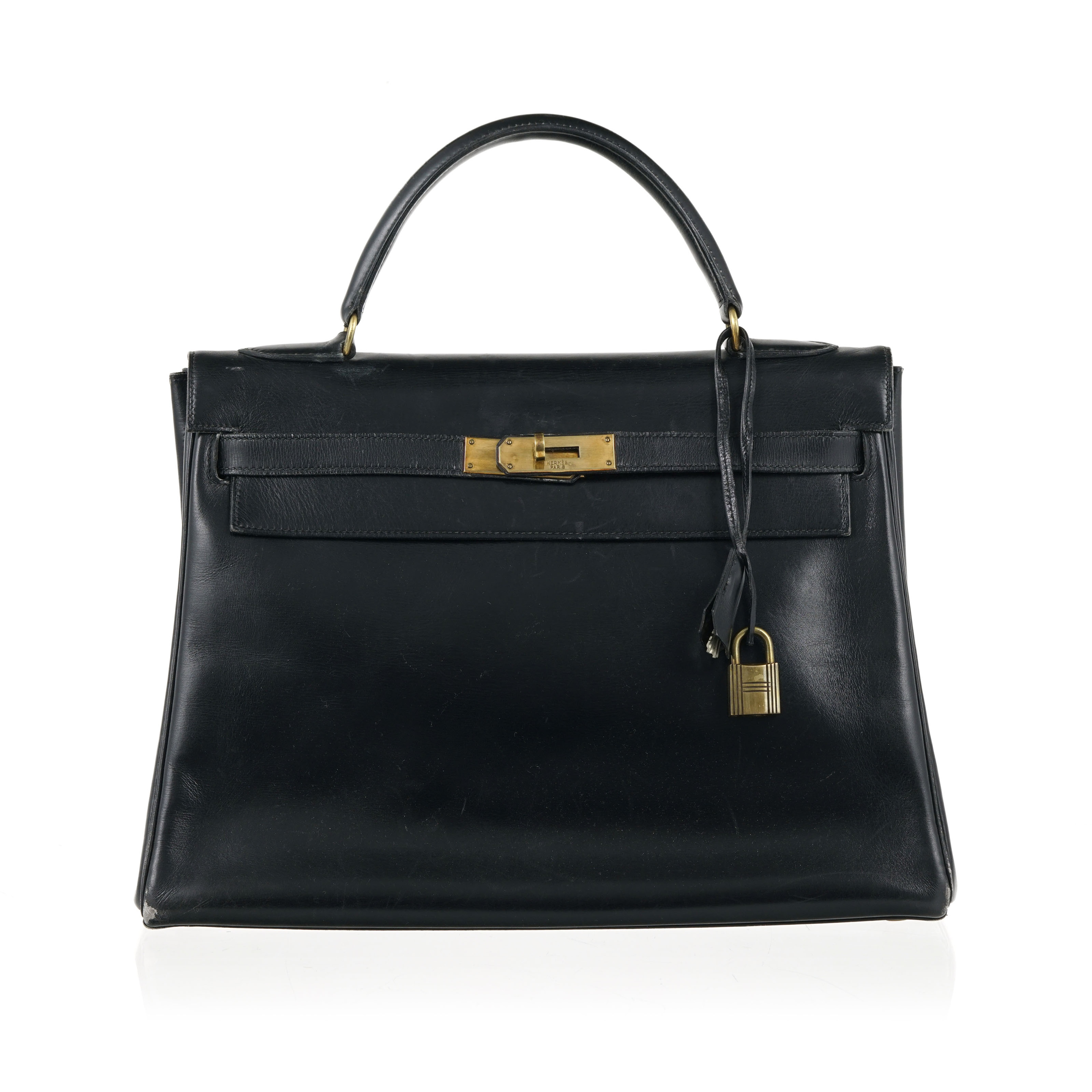 Hermès, sac Kelly 32 retourné en cuir de box noir,… | Piguet